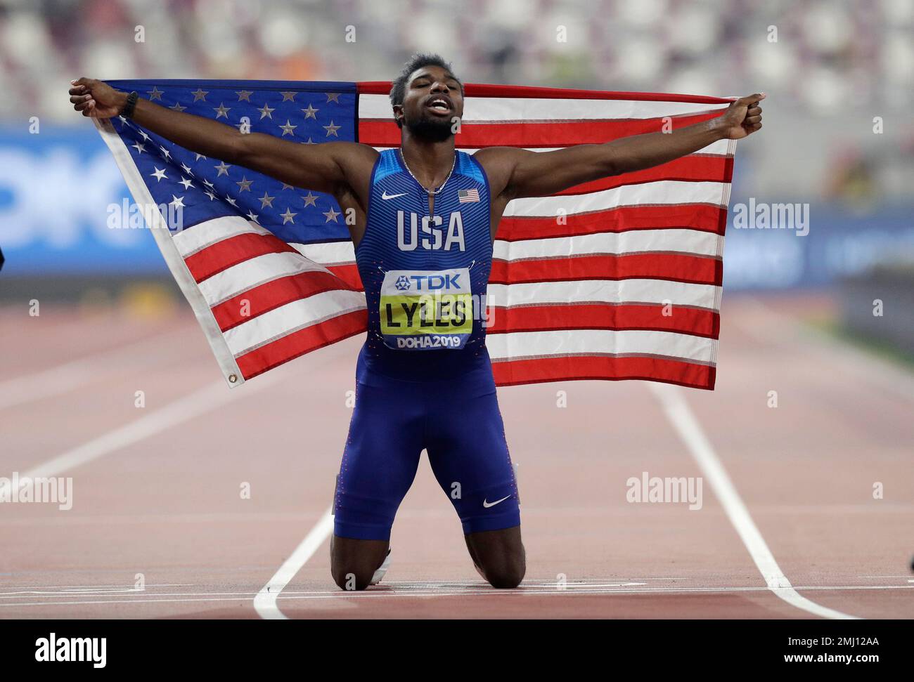 Noah Lyles of the U.S., celebrates winning the gold medal in the men's ...
