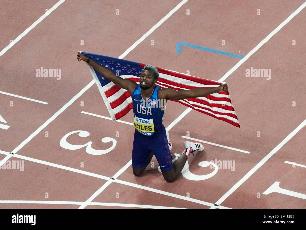 Noah Lyles of the United States pauses at the finish line after winning ...