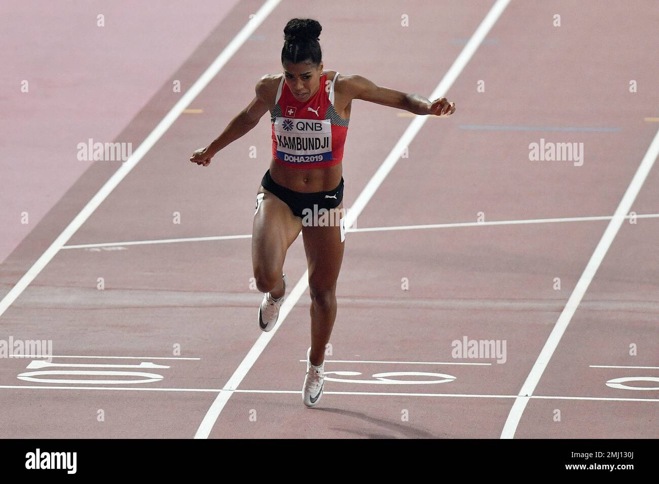 Mujinga Kambundji, of Switzerland, competes during the women's 200 ...