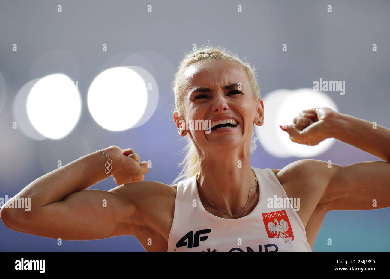 Justyna Swiety-Ersetic, of Poland reacts after finishing a women's 400 ...
