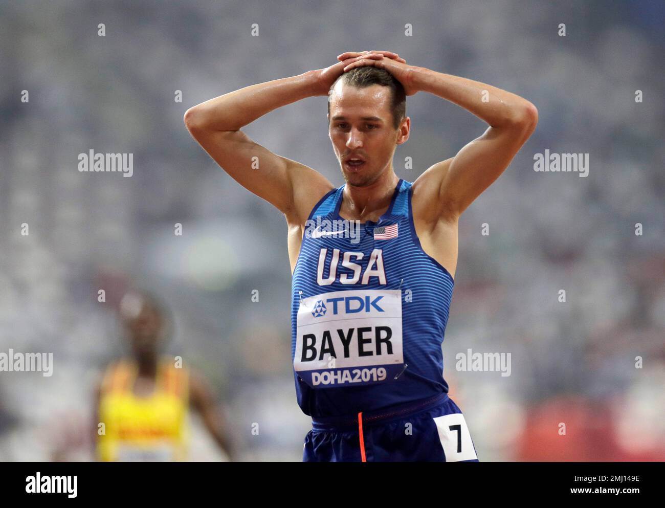 Andrew Bayer, of the United States reacts after finishing a men's 3000 ...