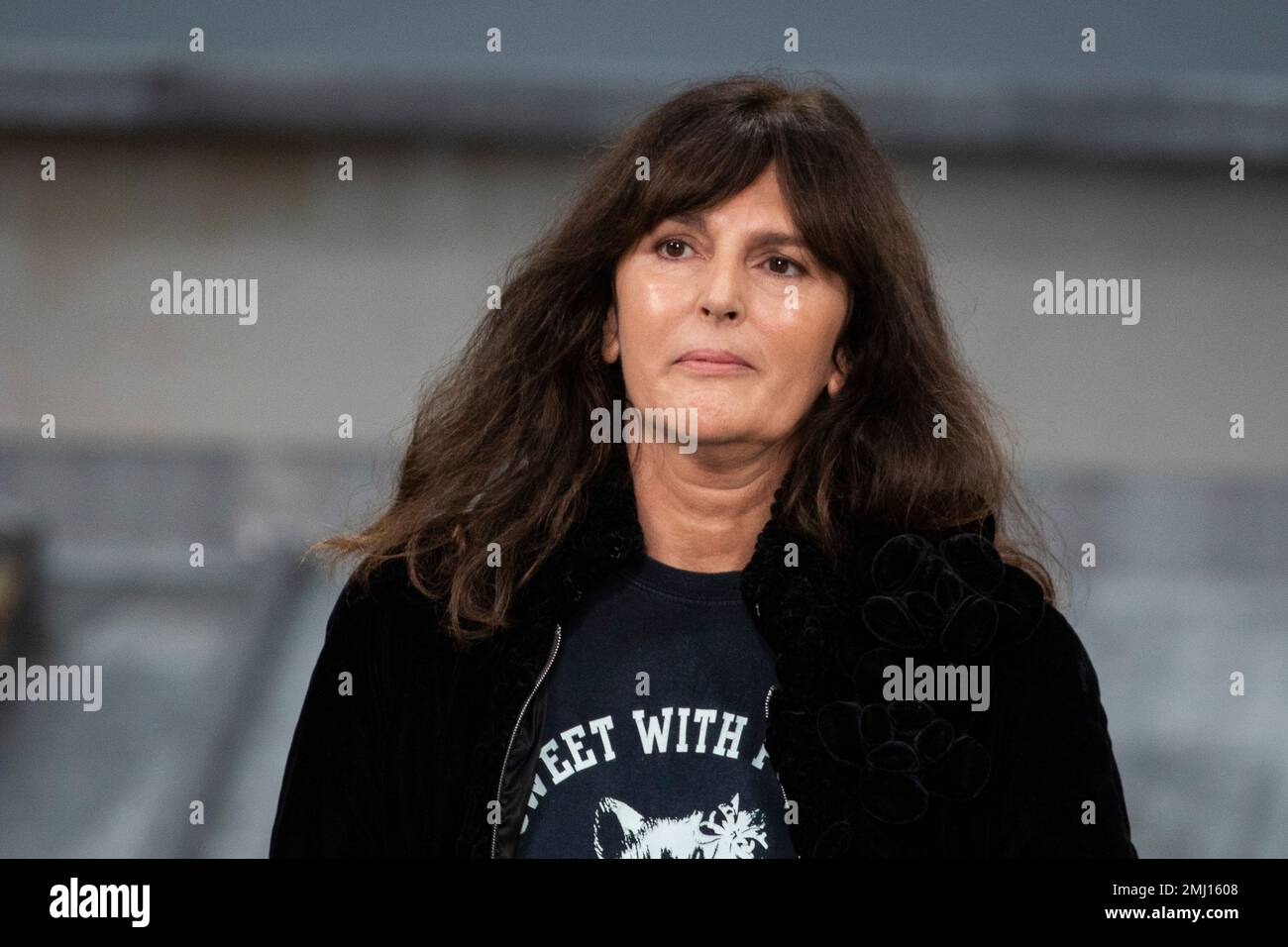 Designer Virginie Viard accepts applause at the conclusion of the ...