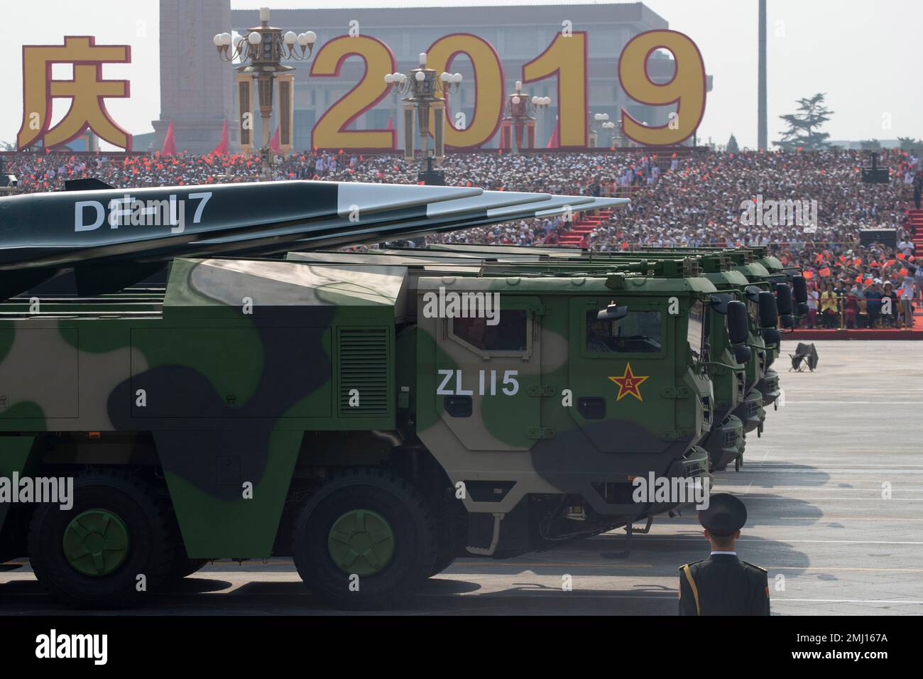 Chinese military vehicles carrying DF-17 roll during a parade to ...