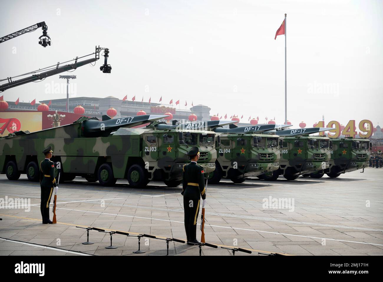 Chinese military vehicles carrying DF-17 ballistic missiles roll during ...