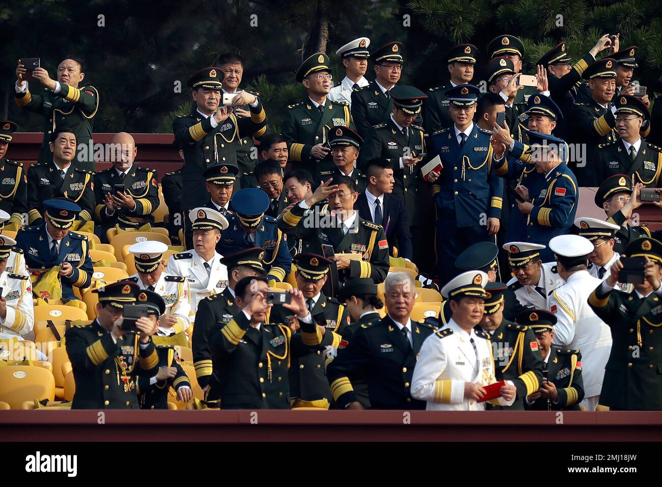 Chinese military officers take photos as they arrive before a large ...