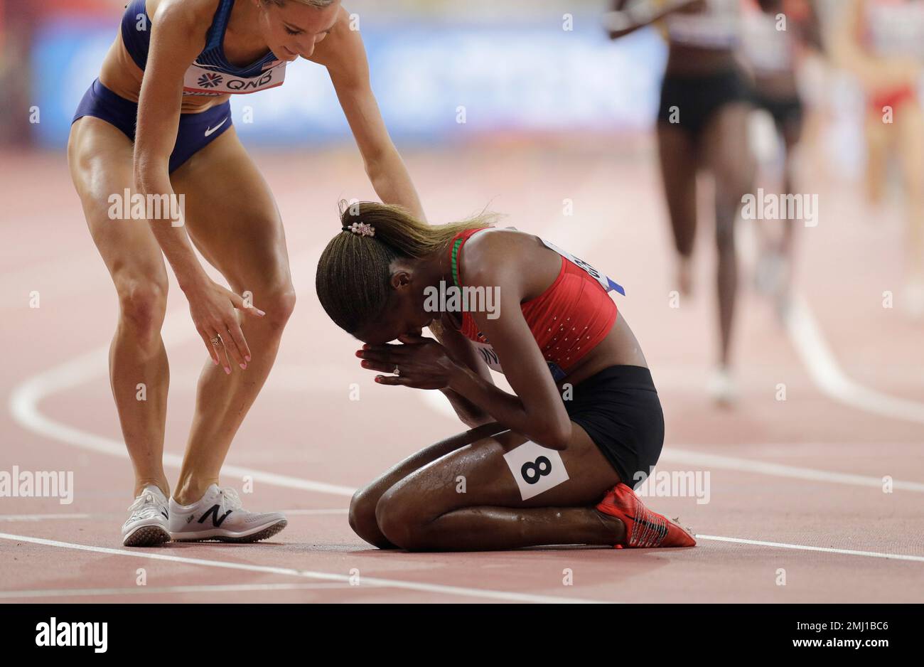 Emma Coburn, of the United States, left, congratulates Beatrice ...