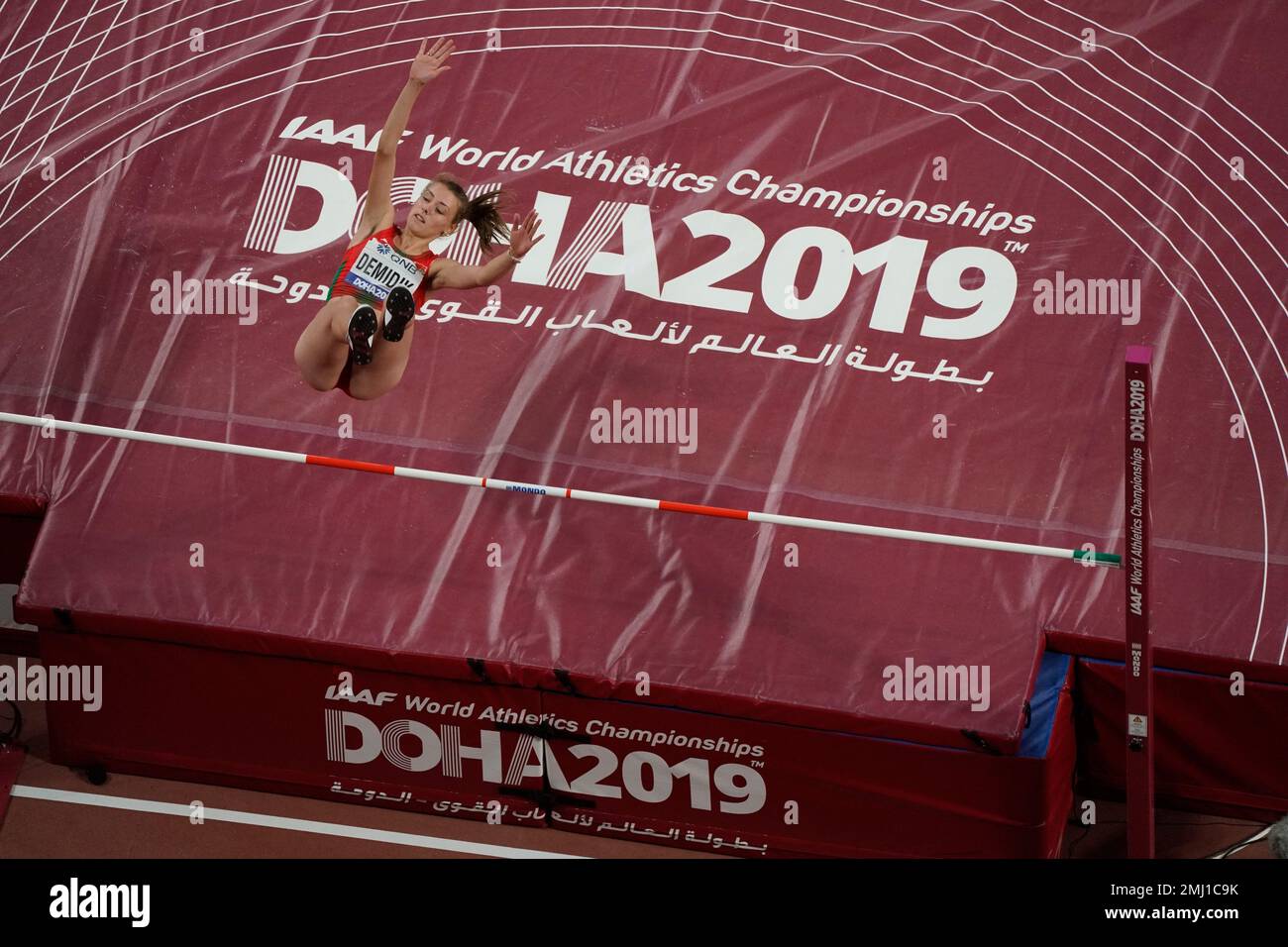 Karyna Demidik, of Belarus, clears the bar during the women's high jump ...