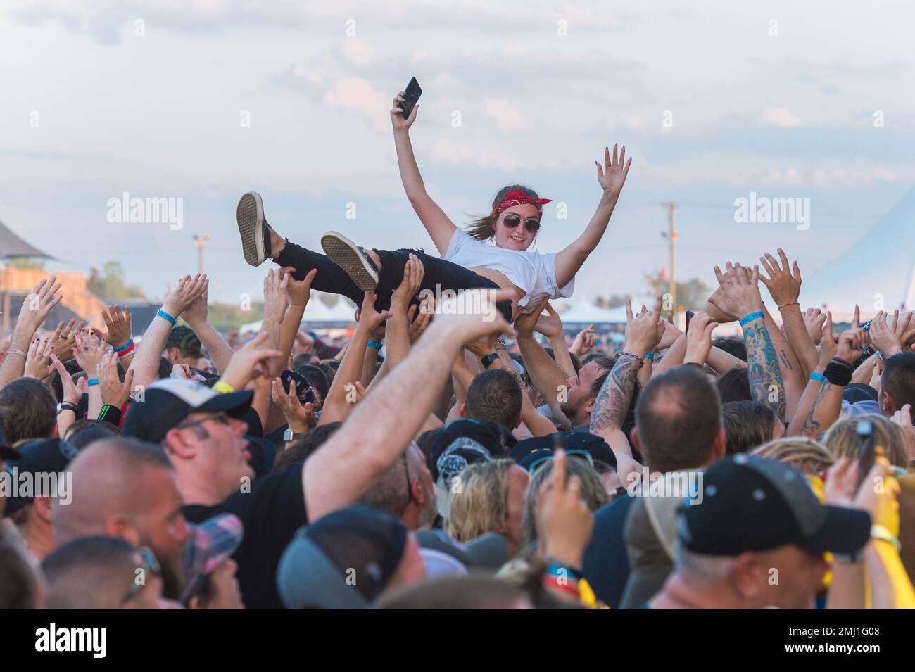 Festival goers crowd surf as Breaking Benjamin performs during Louder ...