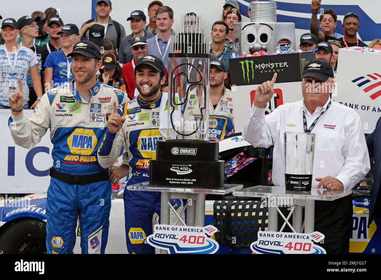 Chase Elliott, center, car owner Rick Hendrick, right, and crew chief ...