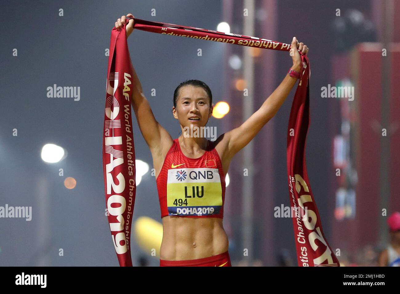 China's Hong Liu celebrates after winning the women's 20 kilometer race ...