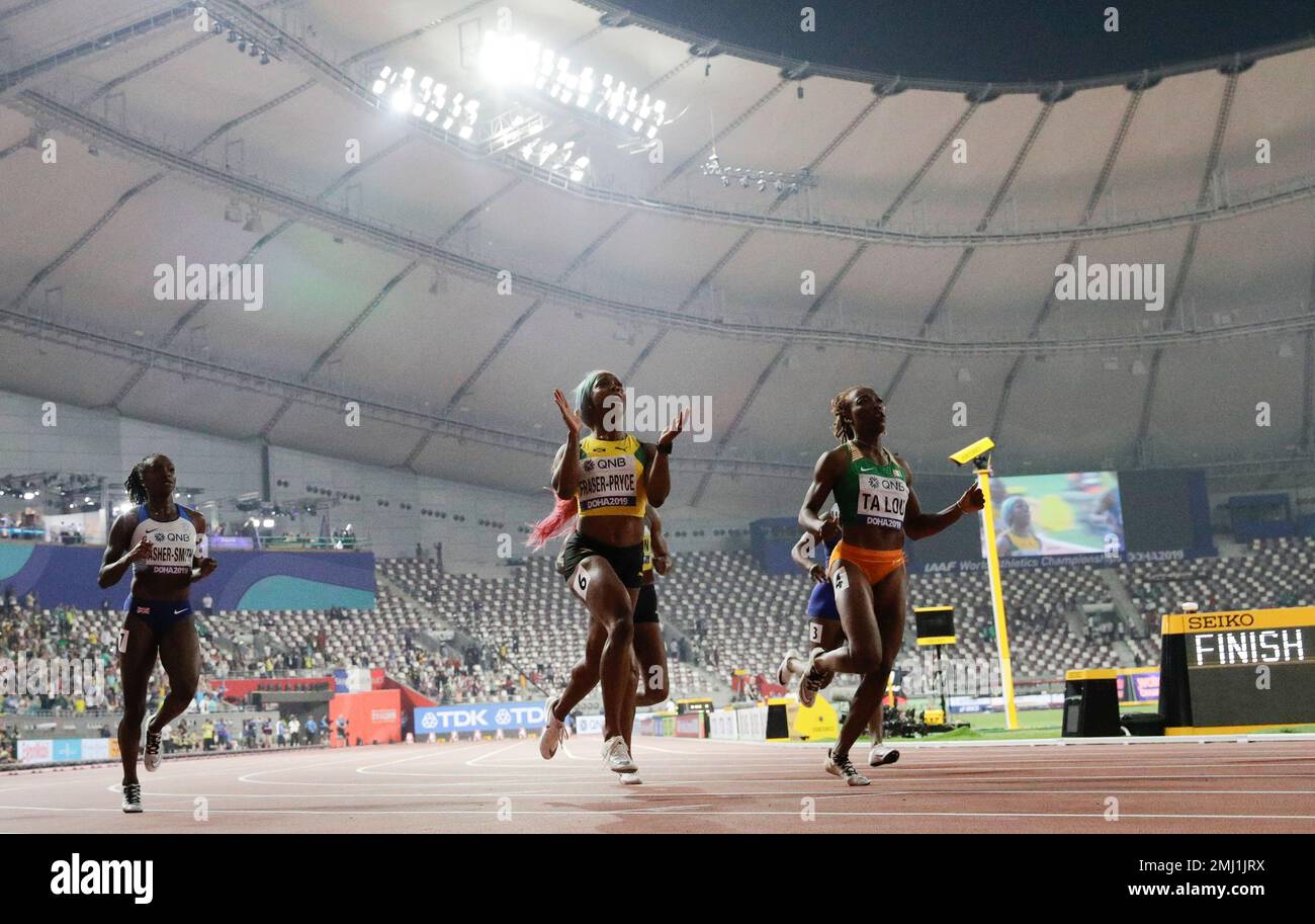 Shelly-Ann Fraser-Pryce, of Jamaica, center, wins the gold medal in the women's 100 meter final ...