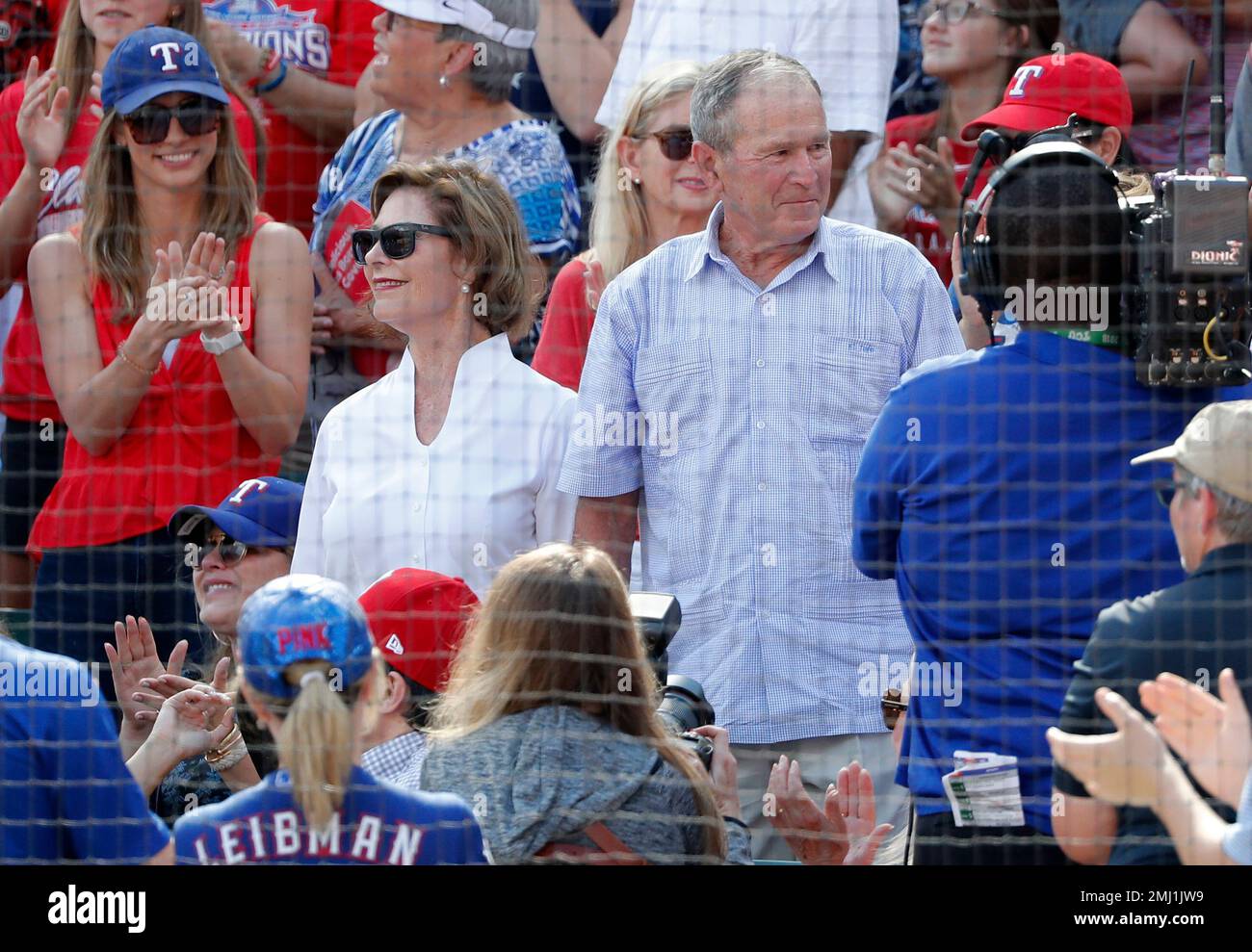 Former first lady Laura Bush, center left, and former President George ...