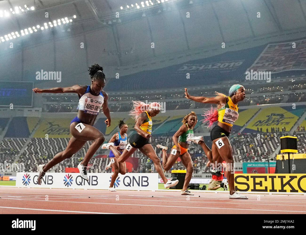 Shelly-Ann Fraser-Pryce, of Jamaica, right, wins the women's 100-meter ...