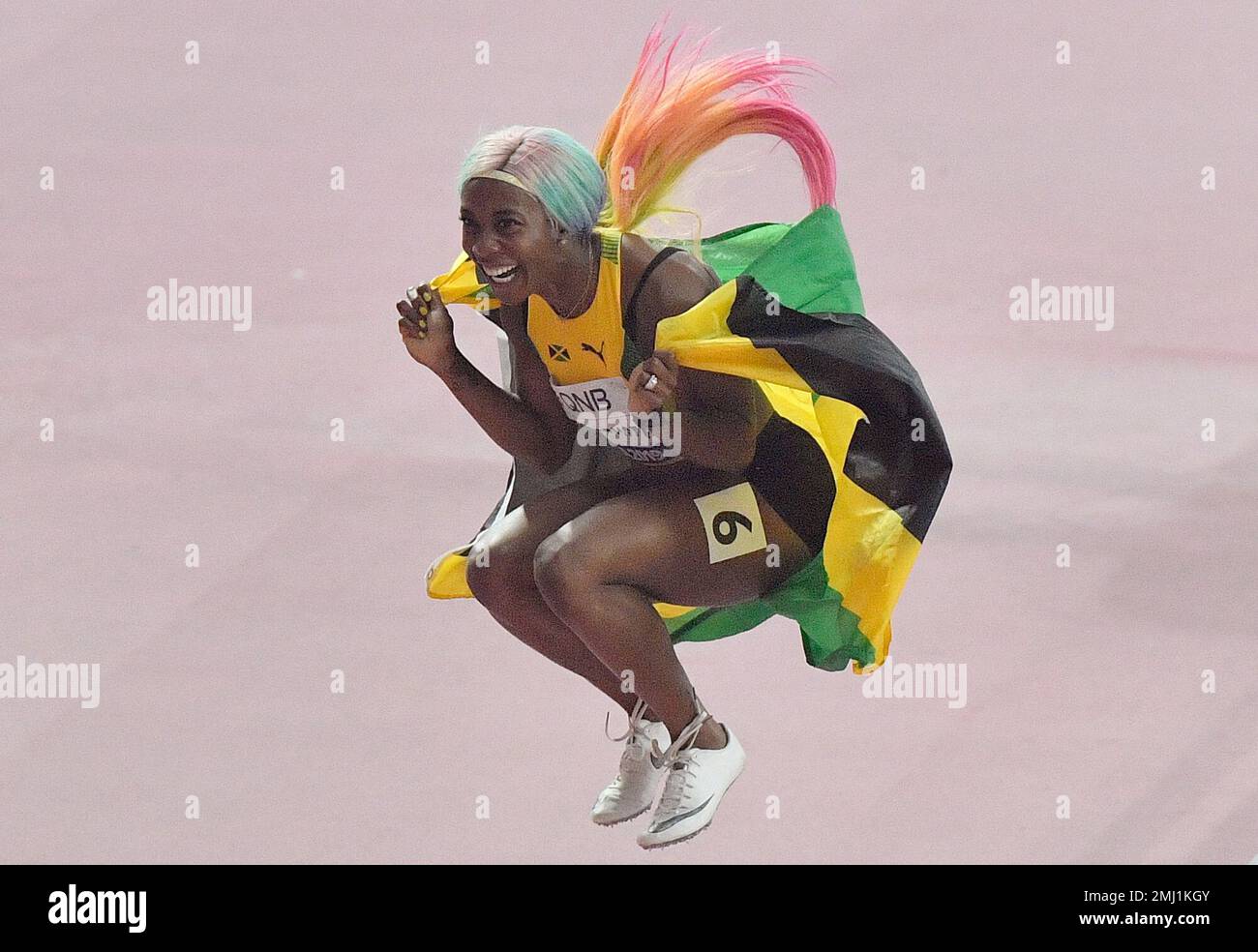 Shelly-Ann Fraser-Pryce, of Jamaica, celebrates after winning the gold ...