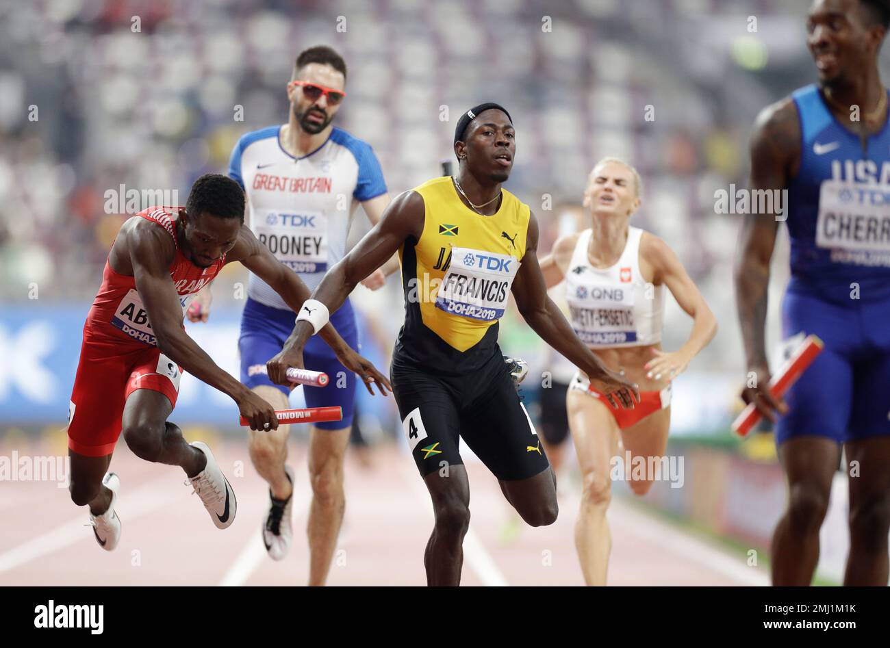 Bahrain's Abbas Abubakar, left, and Jamaica's Javon Francis run the ...