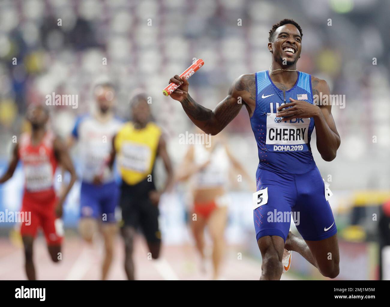 Michael Cherry of the United States celebrates after anchoring the US ...