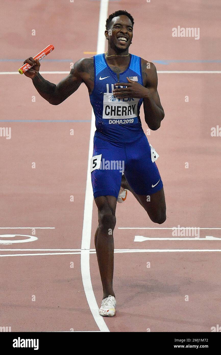Michael Cherry, of the United States, crosses the finish line to win in ...
