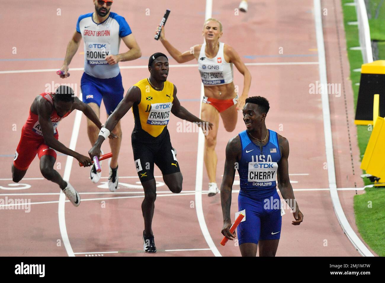 Michael Cherry, of the United States, looks back after crossing the ...