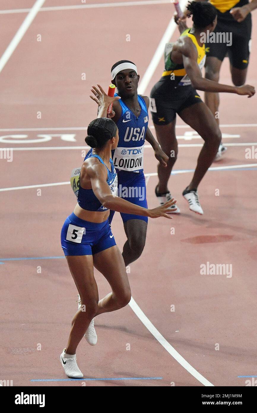 Allyson Felix, of the United States, gets the baton from teammate ...