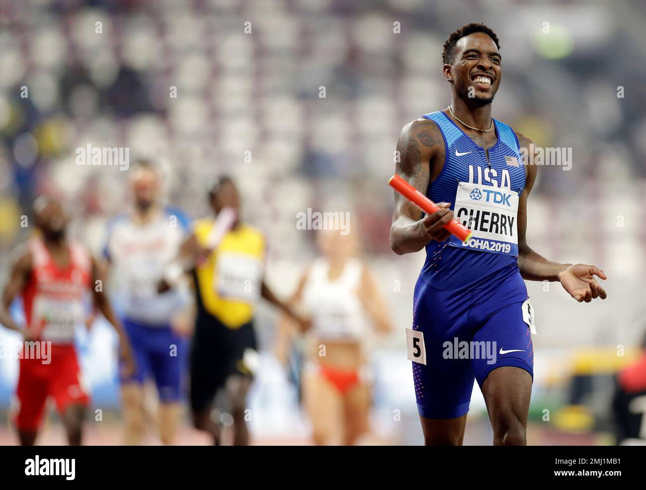 Michael Cherry of the United States celebrates after anchoring the US ...