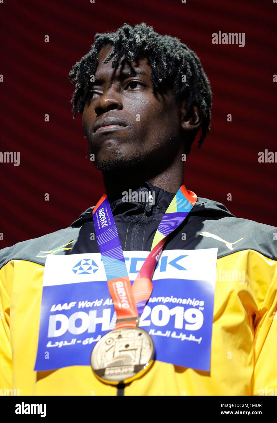 Tajay Gayle of Jamaica, gold winner, stands during the medal ceremony ...