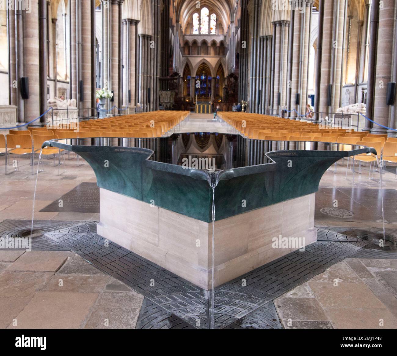 Interior view of Salisbury cathedral showing a modern baptismal font ...