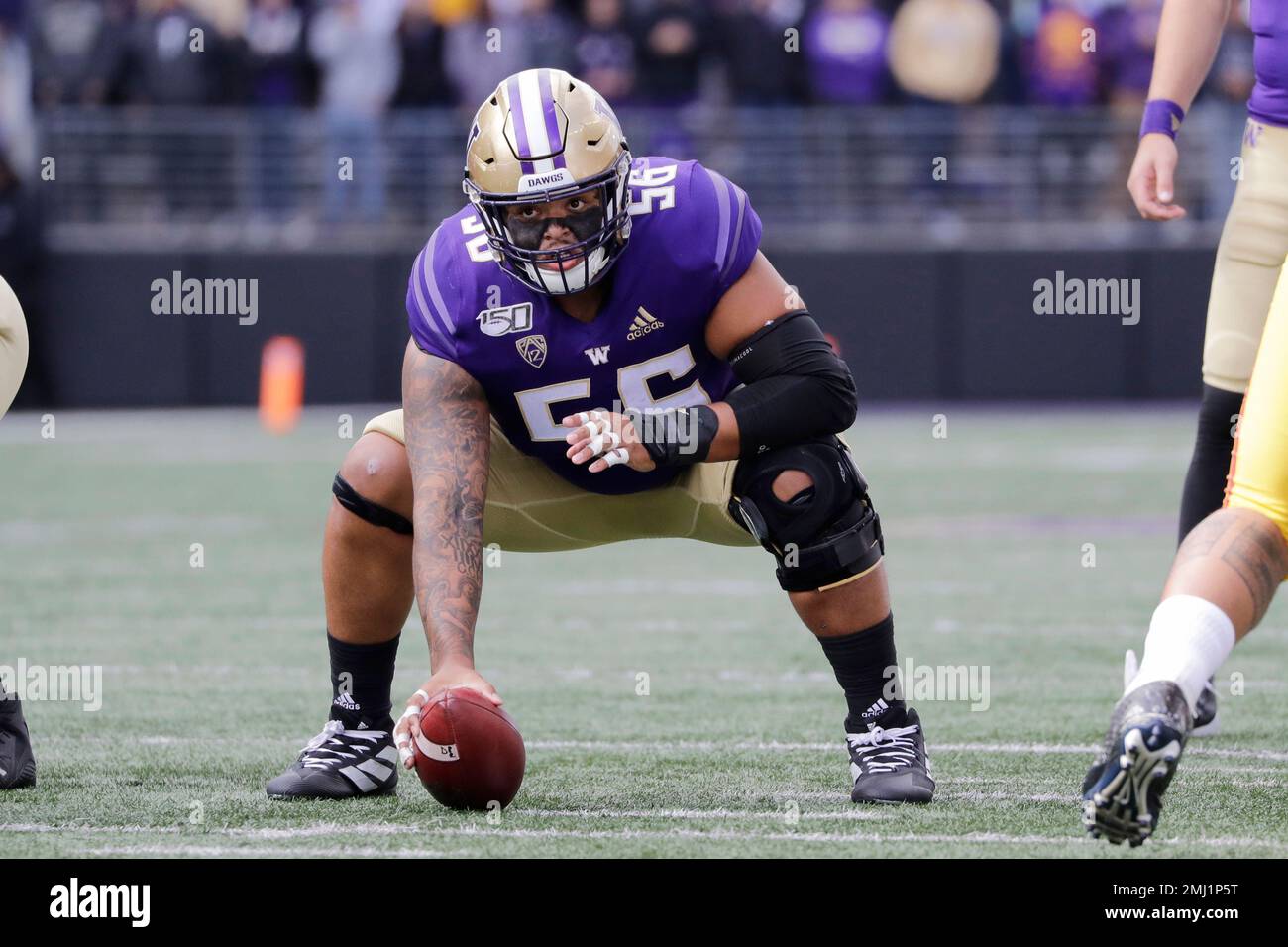 Washington's Nick Harris lines-up during an NCAA college football game ...