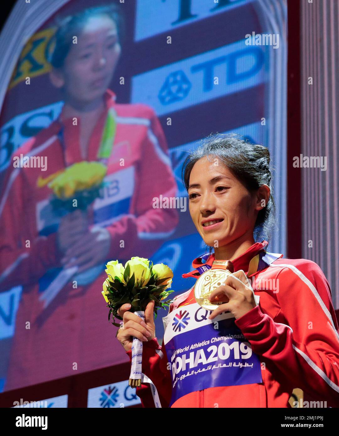 Rui Liang of China, gold winner, smiles during the medal ceremony for ...