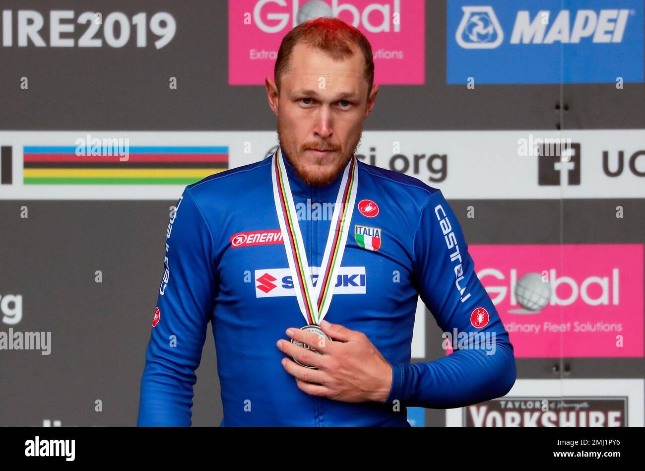 Italy's Matteo Trentin poses with his silver medal of the men elite ...