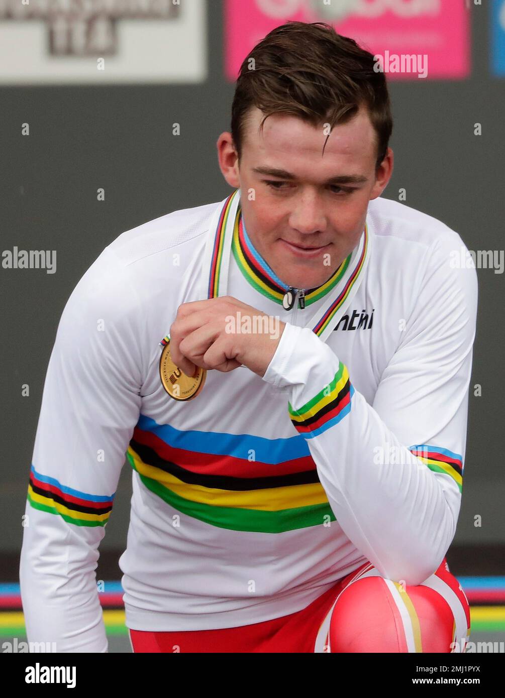 Denmark's Mads Pedersen poses with the gold medal of the men elite race ...