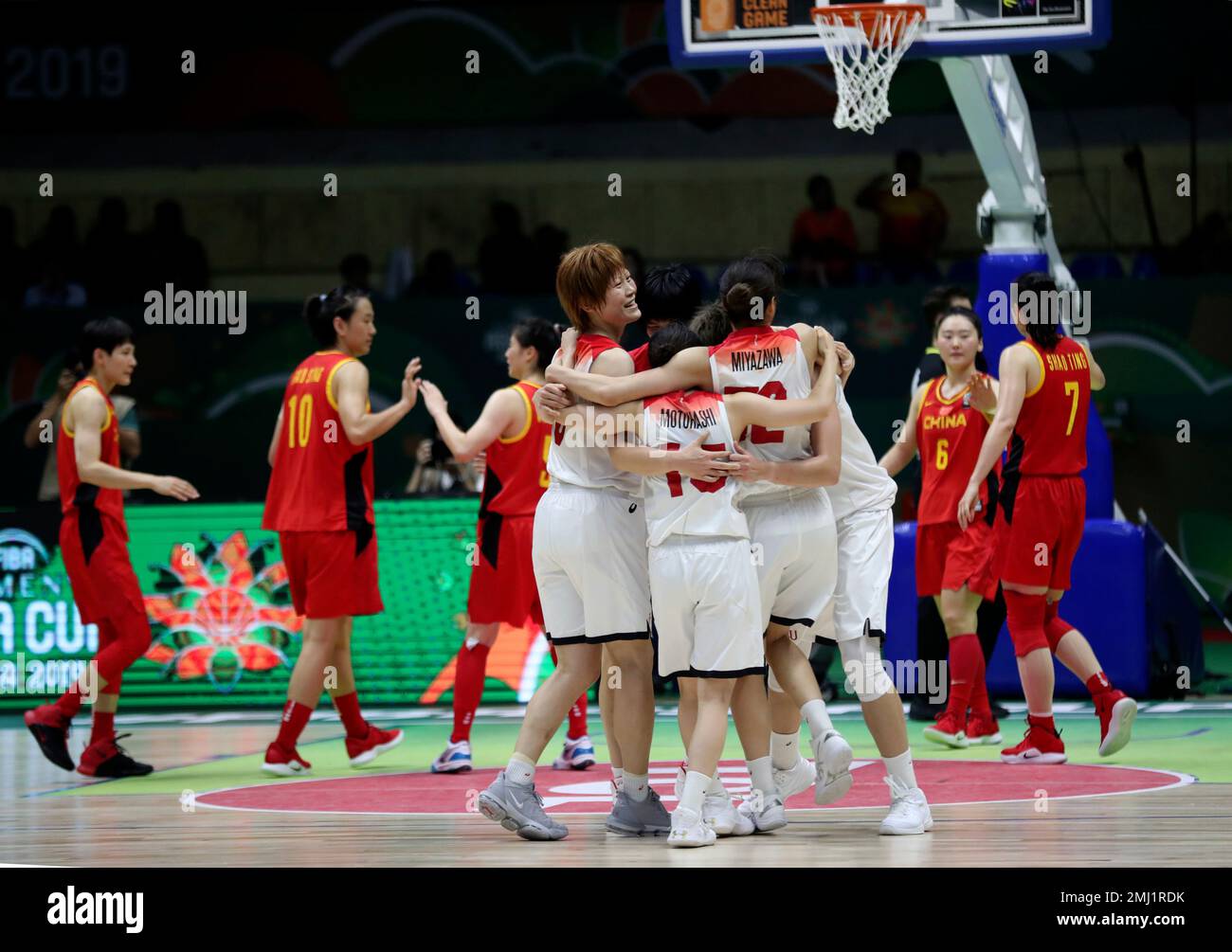 Japanese players, center, celebrate after their win in the FIBA ...