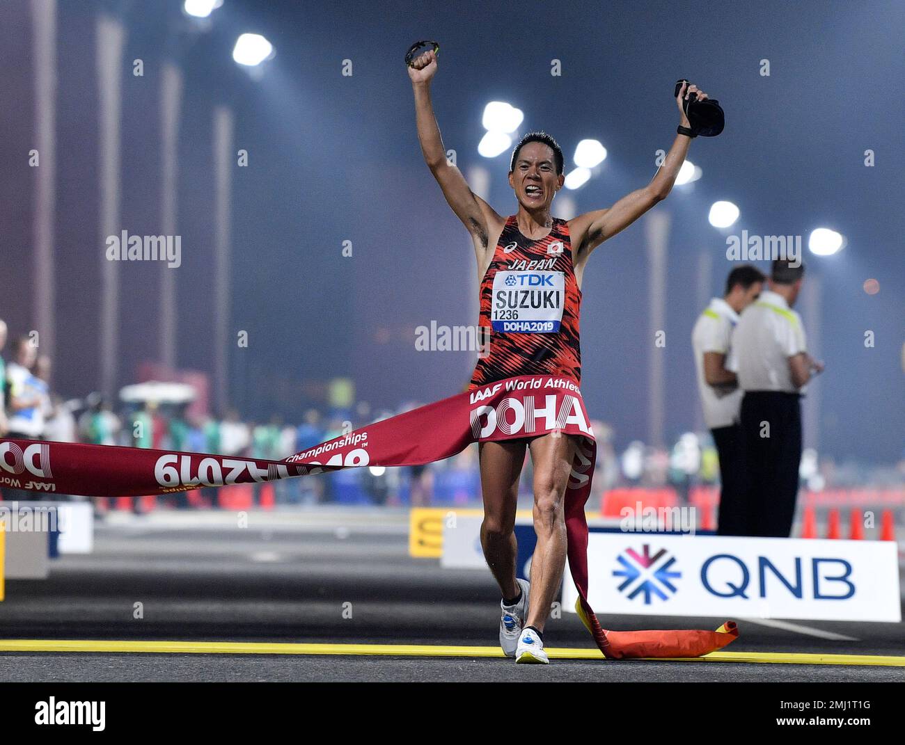 Japan's Yusuke Suzuki walks to winning the men's 50 kilometer race walk ...