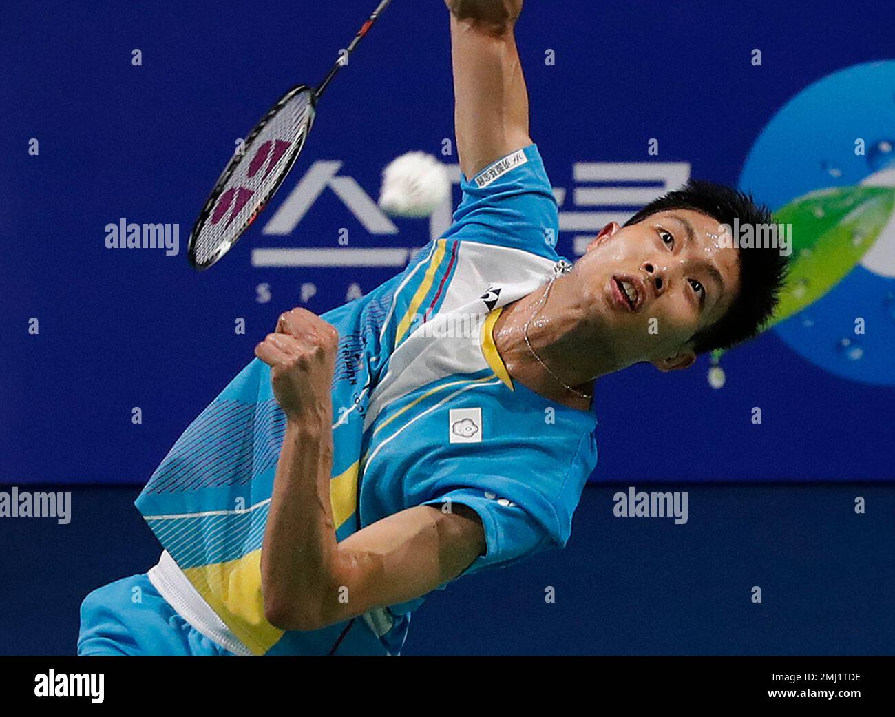 Taiwan's Chou Tien Chen returns a shot during men's single final match ...
