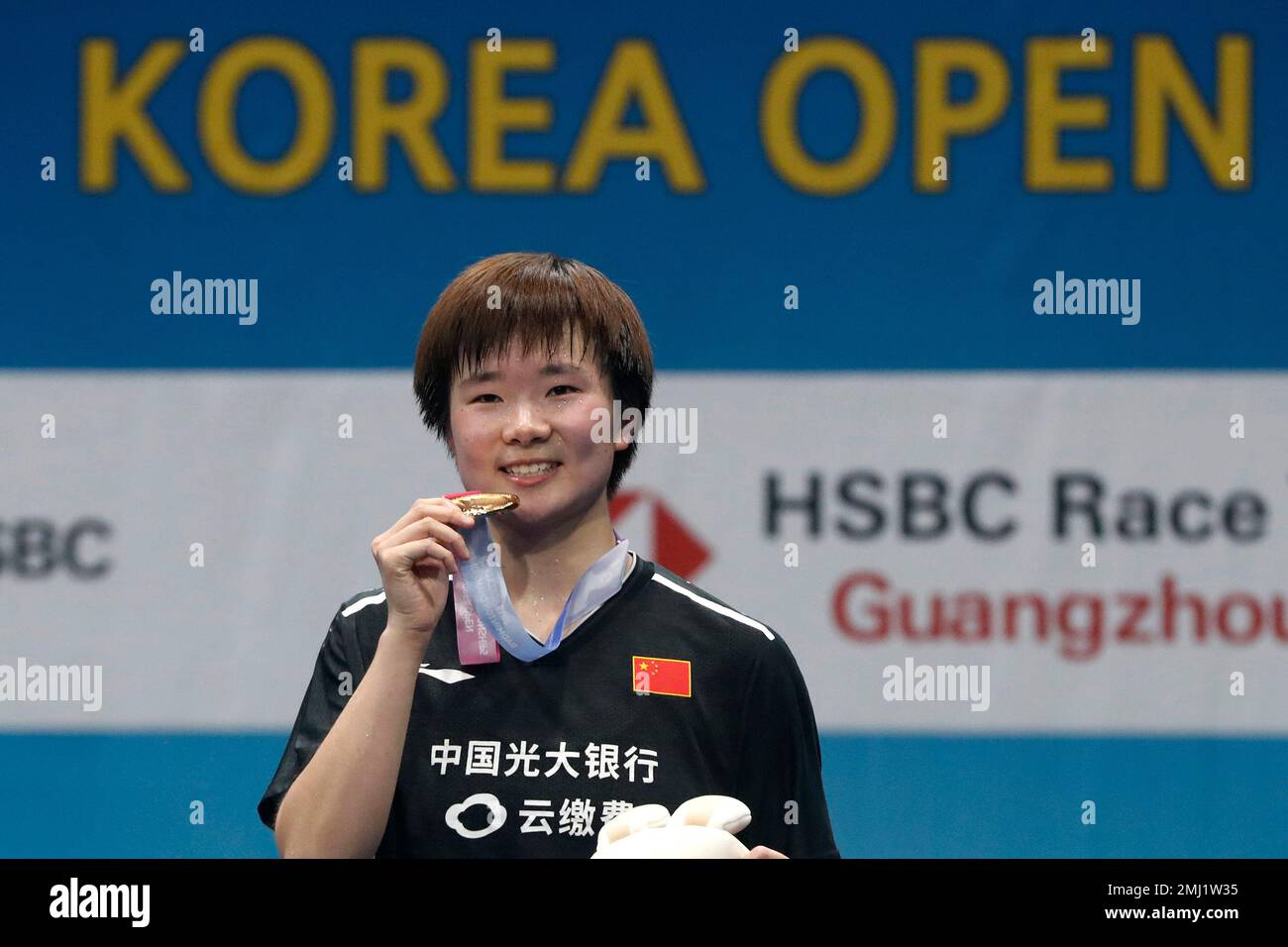 China's He Bing Jiao poses during the awards ceremony after winning ...