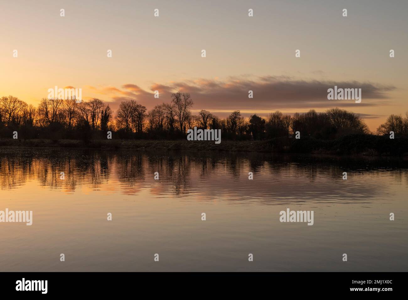 Winter sunrise reflections at Colwick Park in Nottingham ...