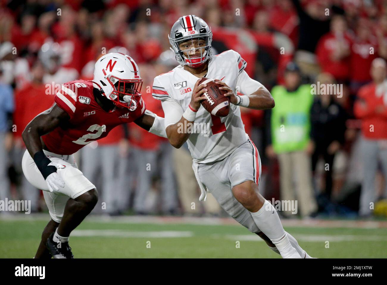 Ohio State quarterback Justin Fields (1) scrambles away from Nebraska ...