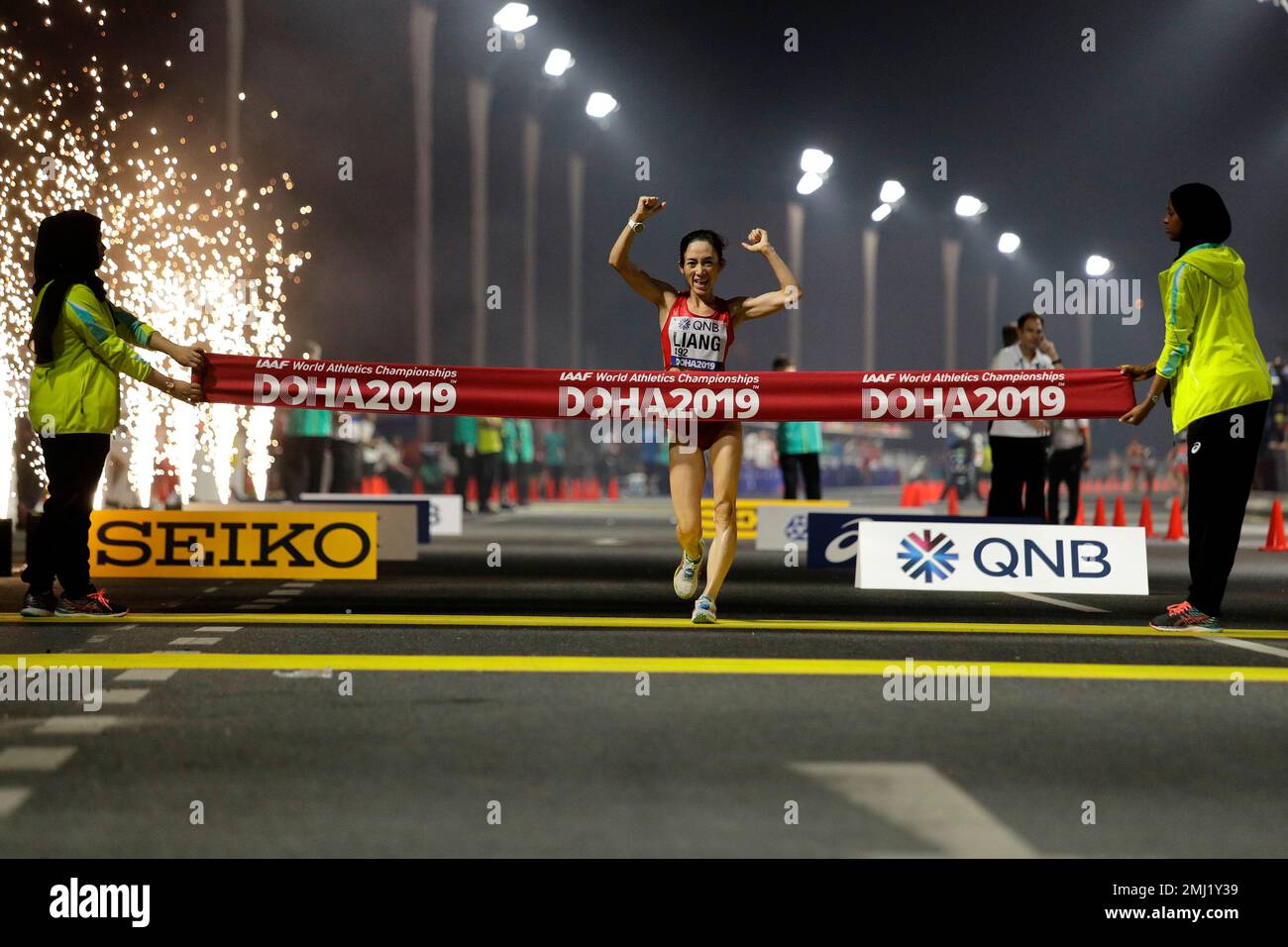 China's Liang Rui celebrates after winning the women's 50 kilometer ...