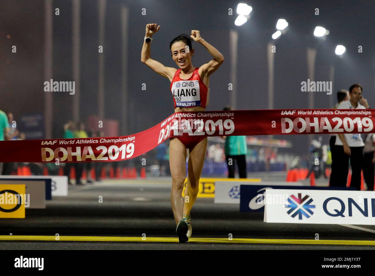 China's Liang Rui celebrates after winning the women's 50 kilometer ...