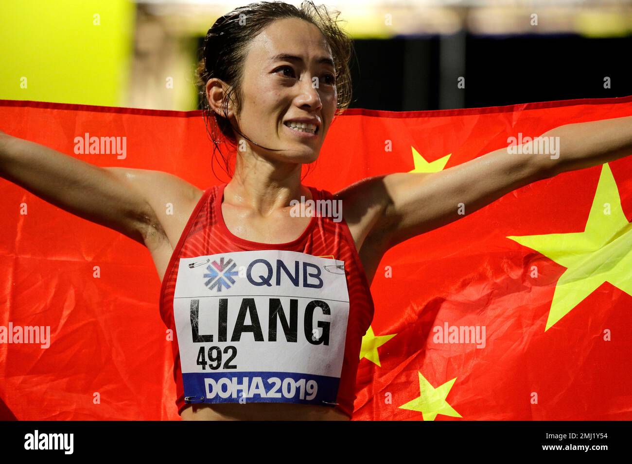China's Liang Rui celebrates after winning the women's 50 kilometer ...