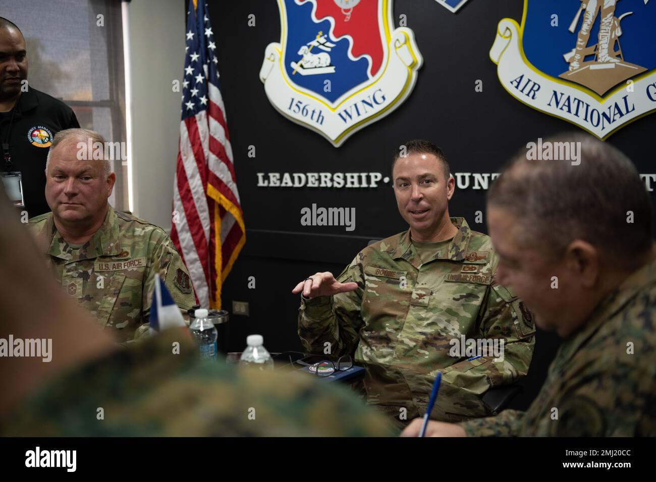 U.S. Air Force Col. Pete Boone, commander, 156th Wing, speaks with ...