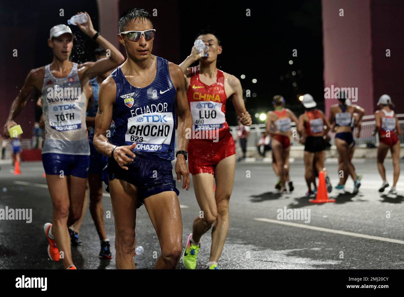 Men and women compete during the 50 kilometer race walk at the World ...