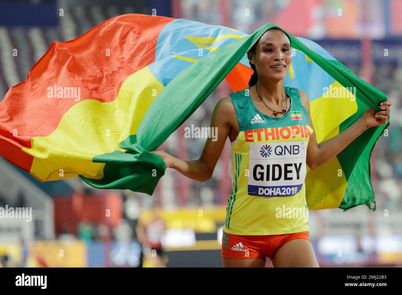 Letesenbet Gidey, of Ethiopia, celebrates winning the silver medal in ...