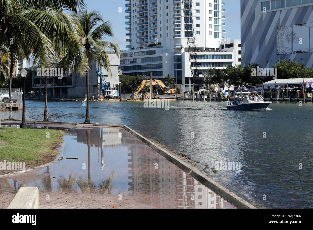 A pedestrian walkway along the Miami River is flooded during a king ...