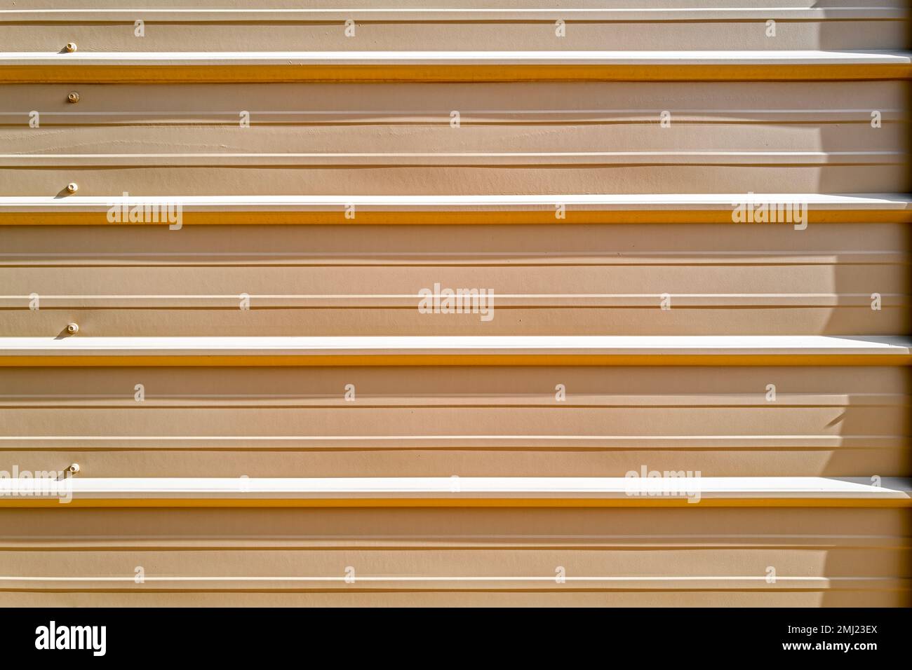 Linear texture of the outer wall of a corrugated metal building Stock ...