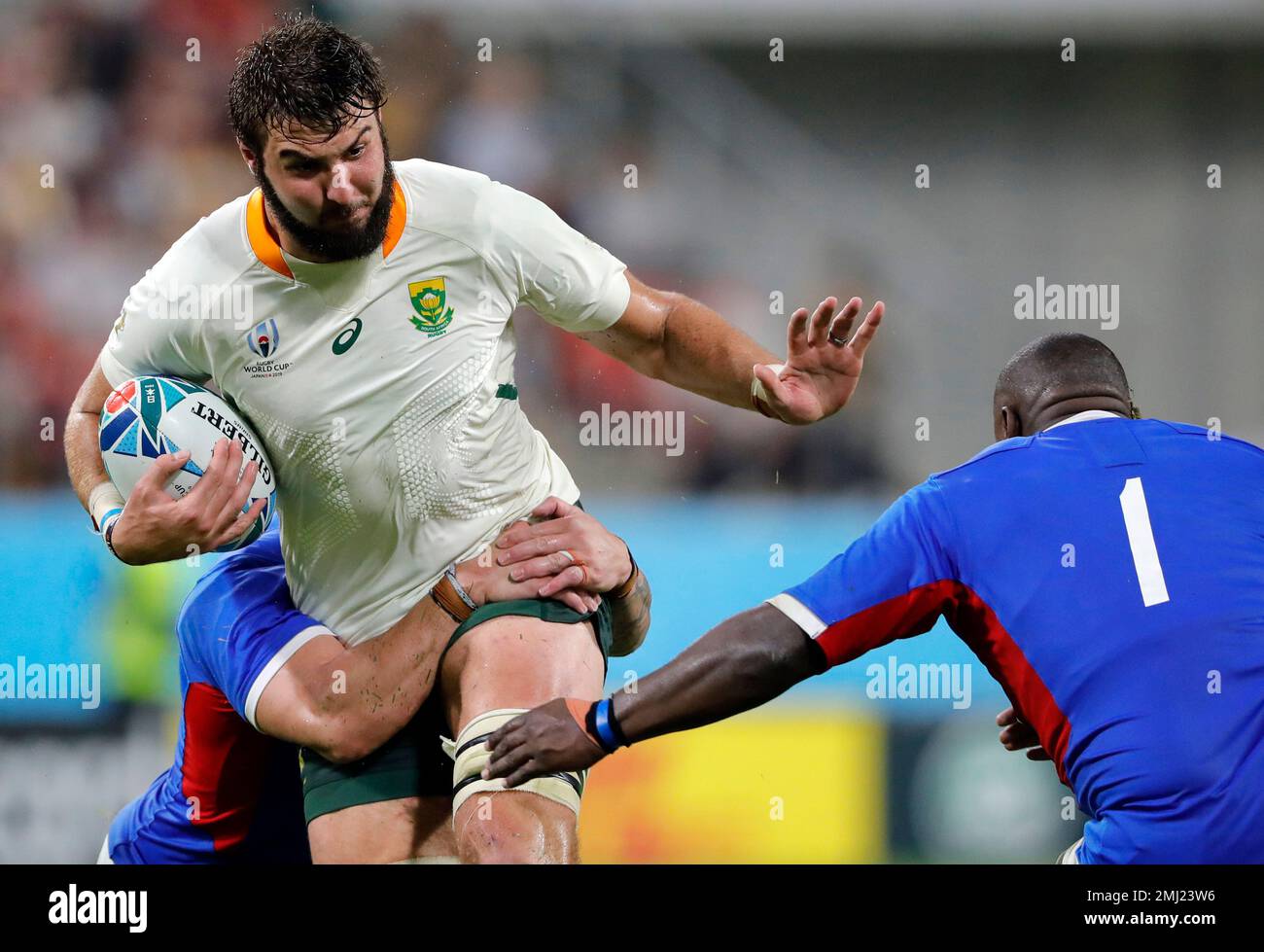 South Africa's Lood de Jager runs at Namibia's Desiderius Sethie, right ...