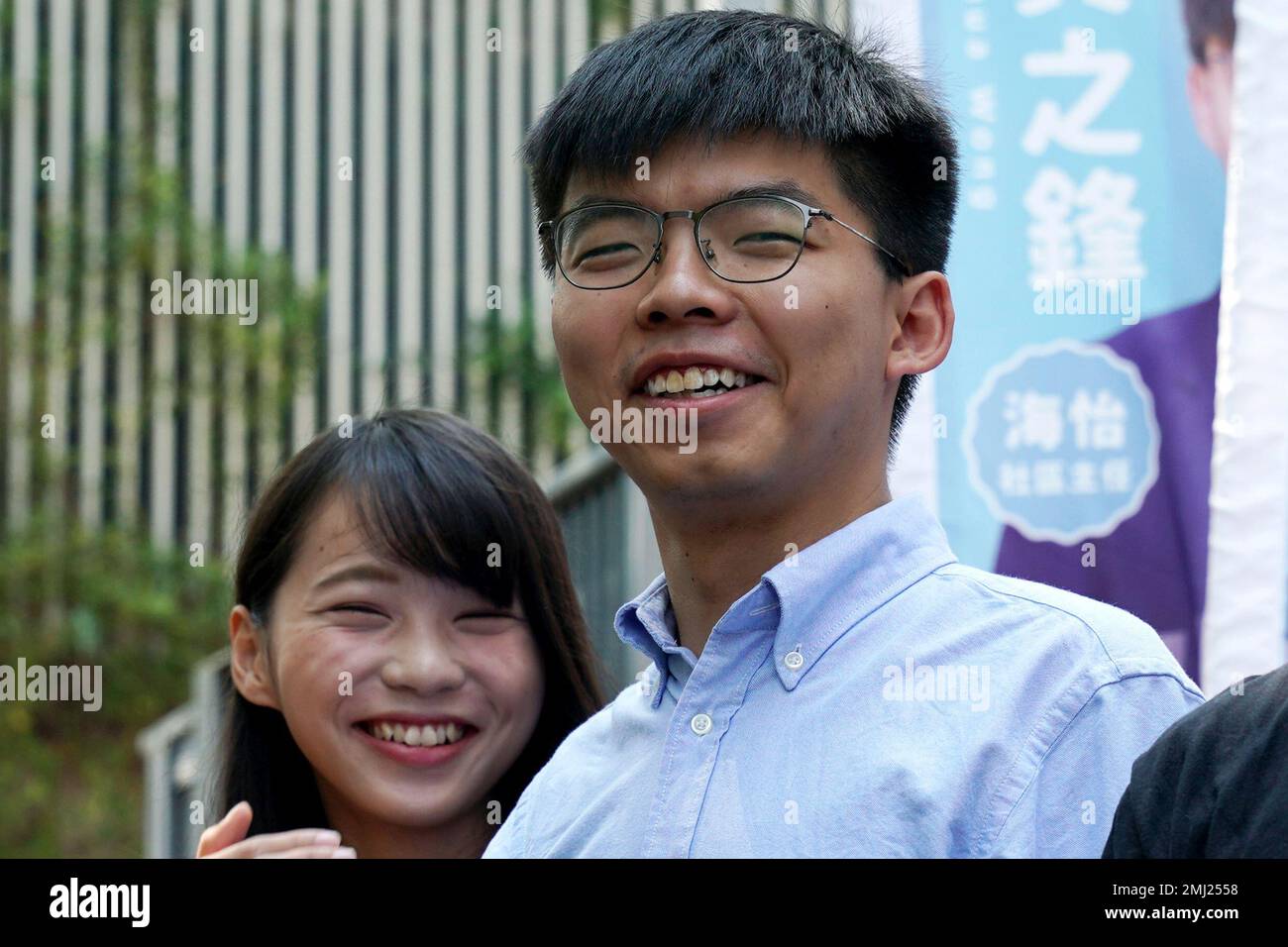 Hong Kong democratic activists Joshua Wong, right, and Agnes Chow ...