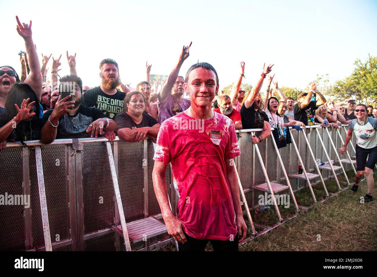 Festival goers covered with fake blood as GWAR performs during Louder ...