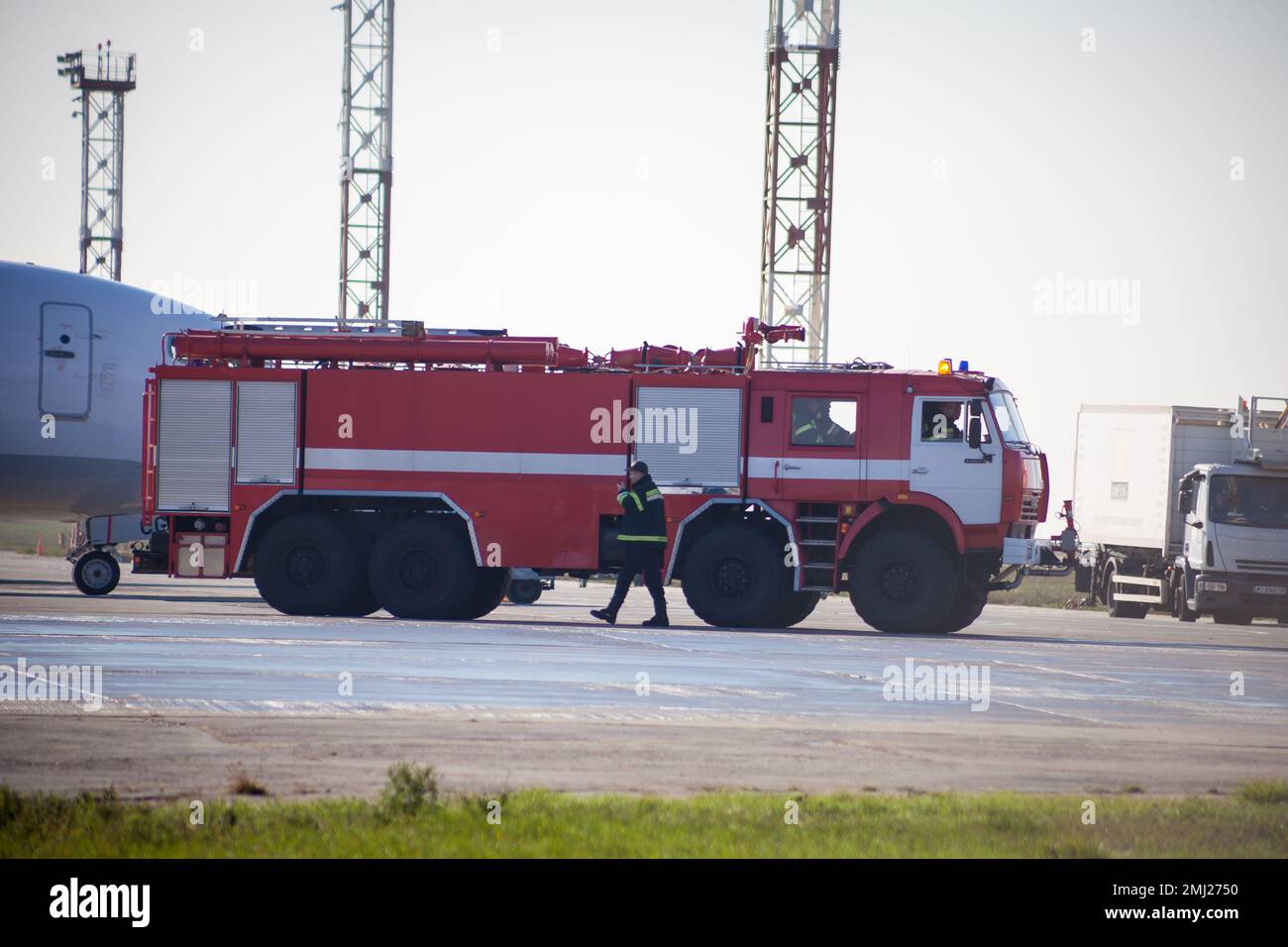 Red fire truck at the airport. Outdoor transportation car. Airport fire ...