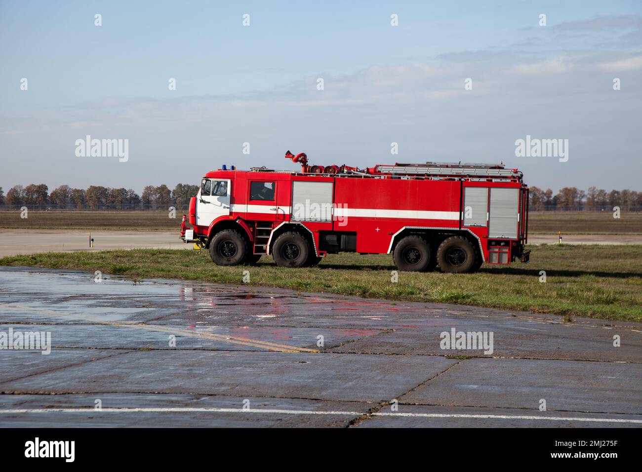 Red fire truck at the airport. Outdoor transportation car. Airport fire ...
