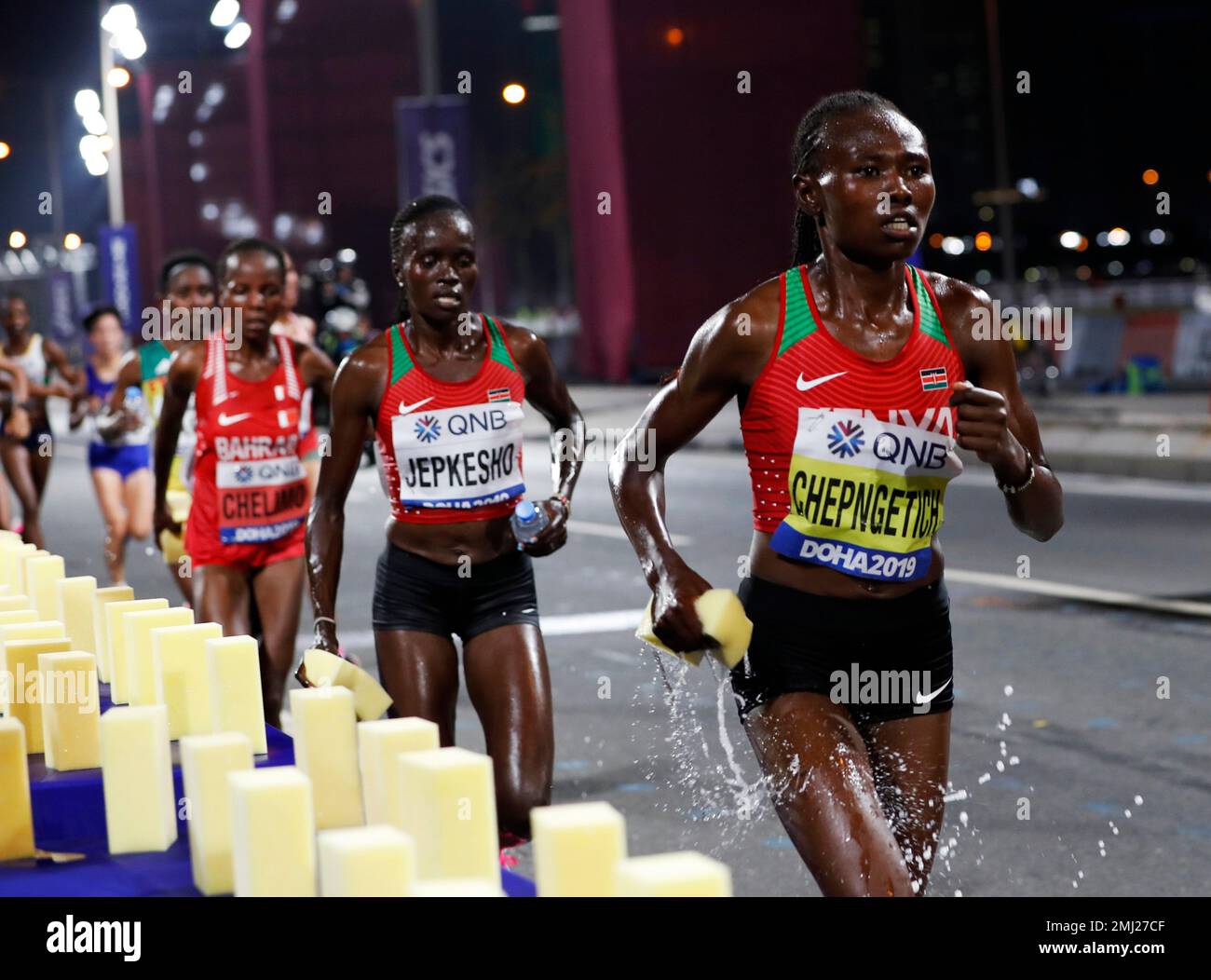Ruth Chepngetich, right and Visiline Jepkesho, second from right, both ...